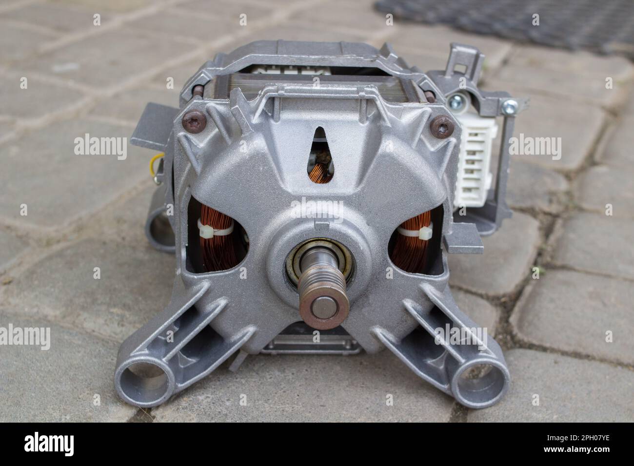 Engine parts for washing machine after repair Stock Photo - Alamy
