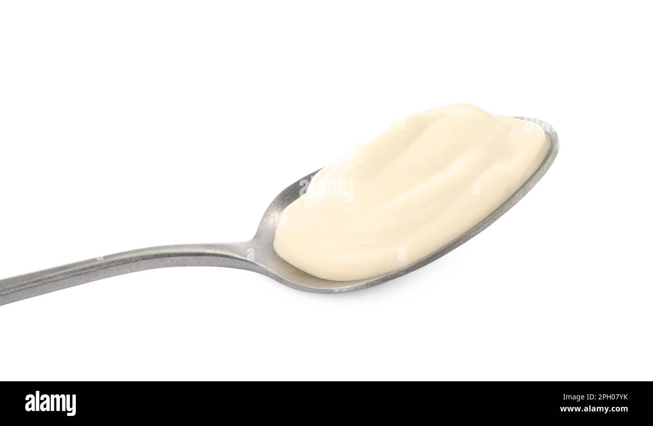 Spoon with tasty mayonnaise isolated on white Stock Photo - Alamy