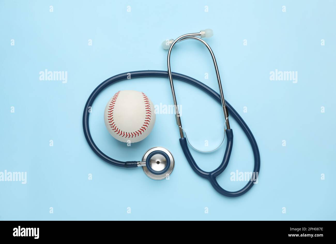 Baseball ball and stethoscope on light blue background, flat lay ...
