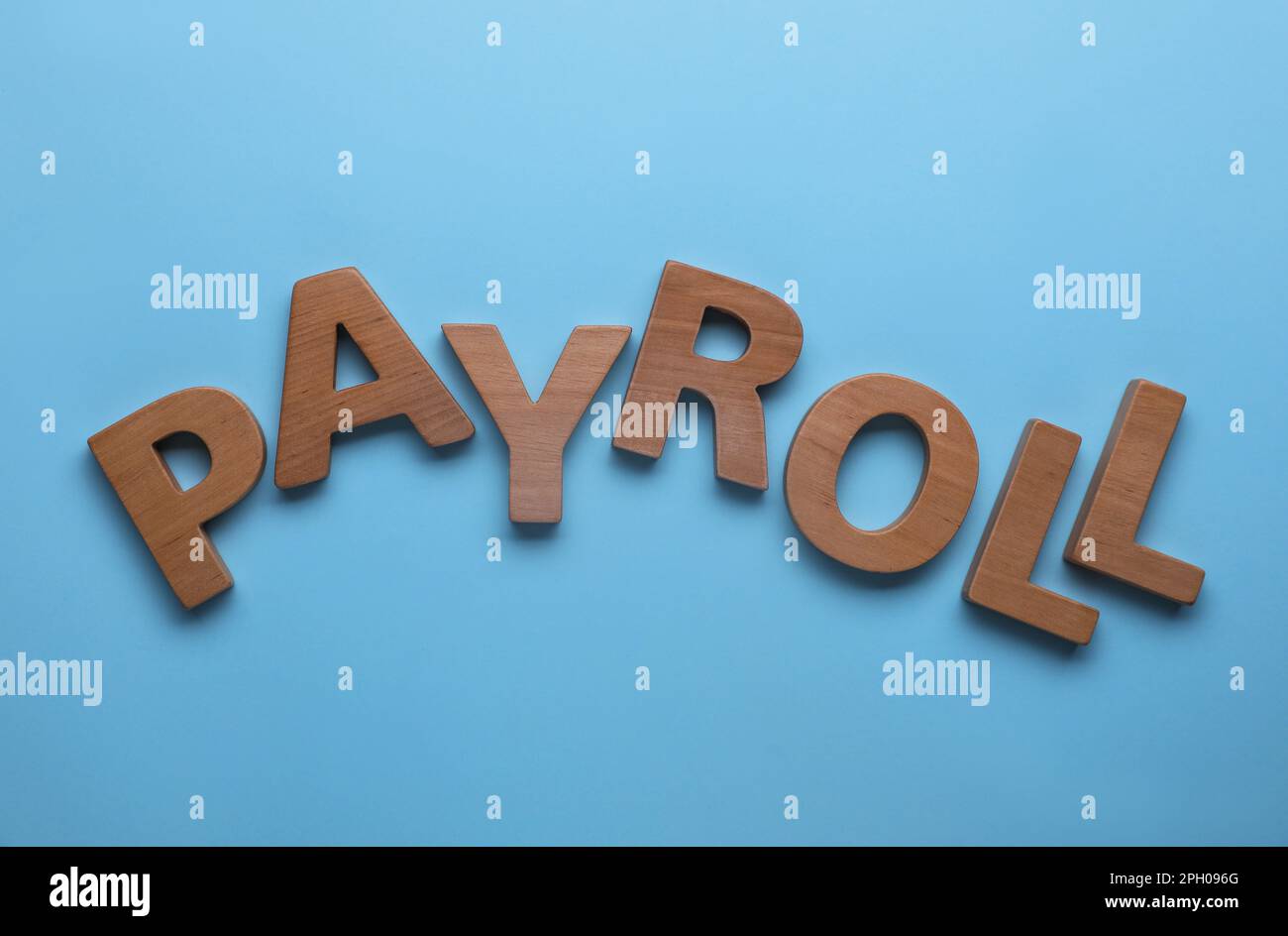 Word Payroll made with wooden letters on light blue background, flat ...