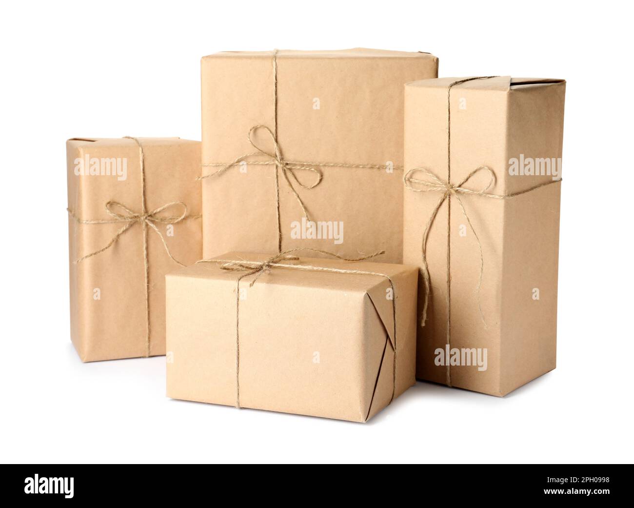 Parcels wrapped with kraft paper and twine on white background Stock ...