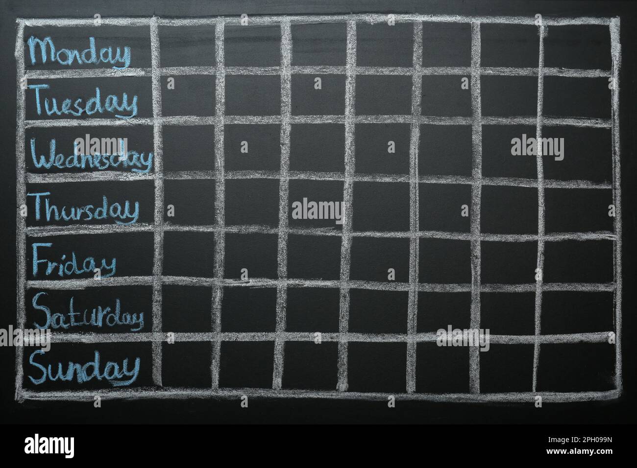 Weekly school timetable drawn on black chalkboard Stock Photo - Alamy