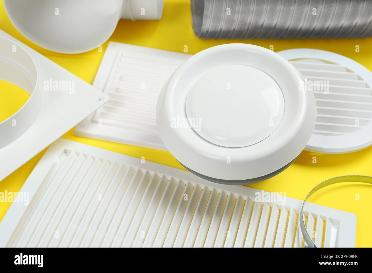 Parts of home ventilation system on yellow background, closeup Stock ...