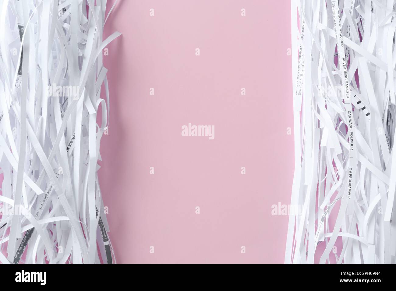 Shredded paper strips on violet background, flat lay. Space for text ...