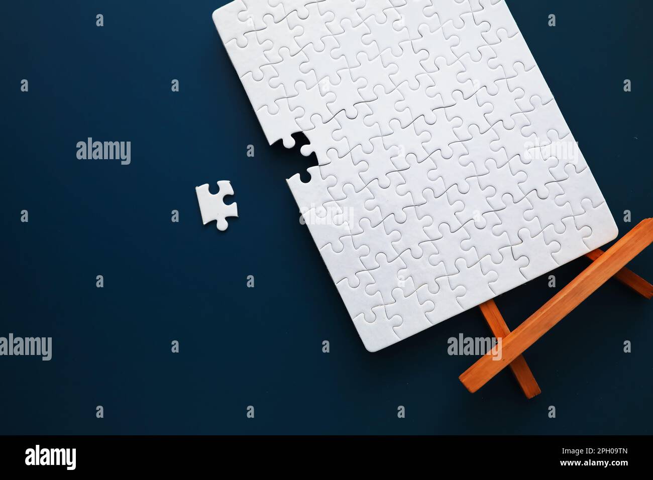 Intellectual puzzles. The puzzle empty. The hand puts together puzzle ...