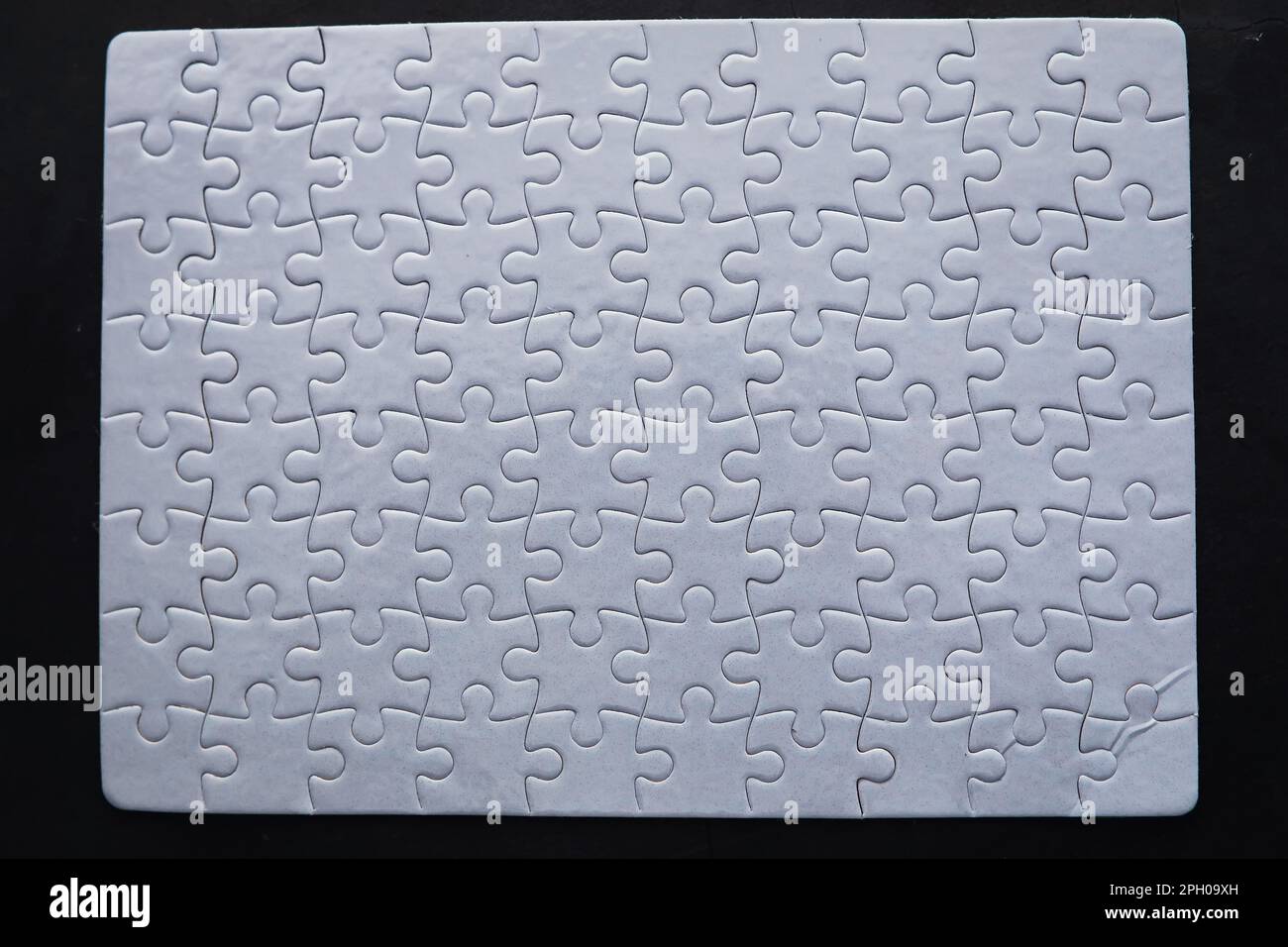 Intellectual puzzles. The puzzle empty. The hand puts together puzzle ...