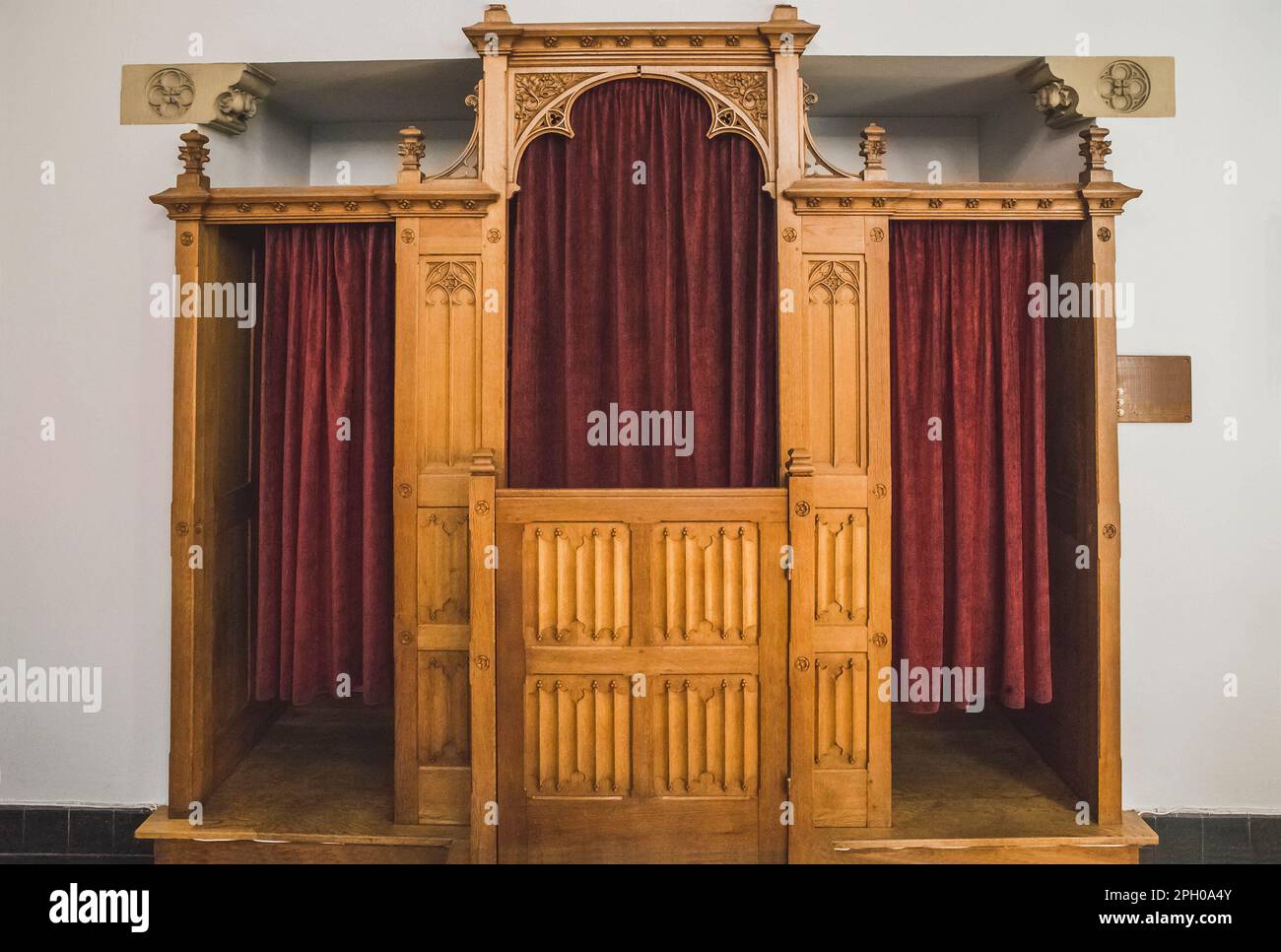 wooden room for confession in the church Stock Photo - Alamy