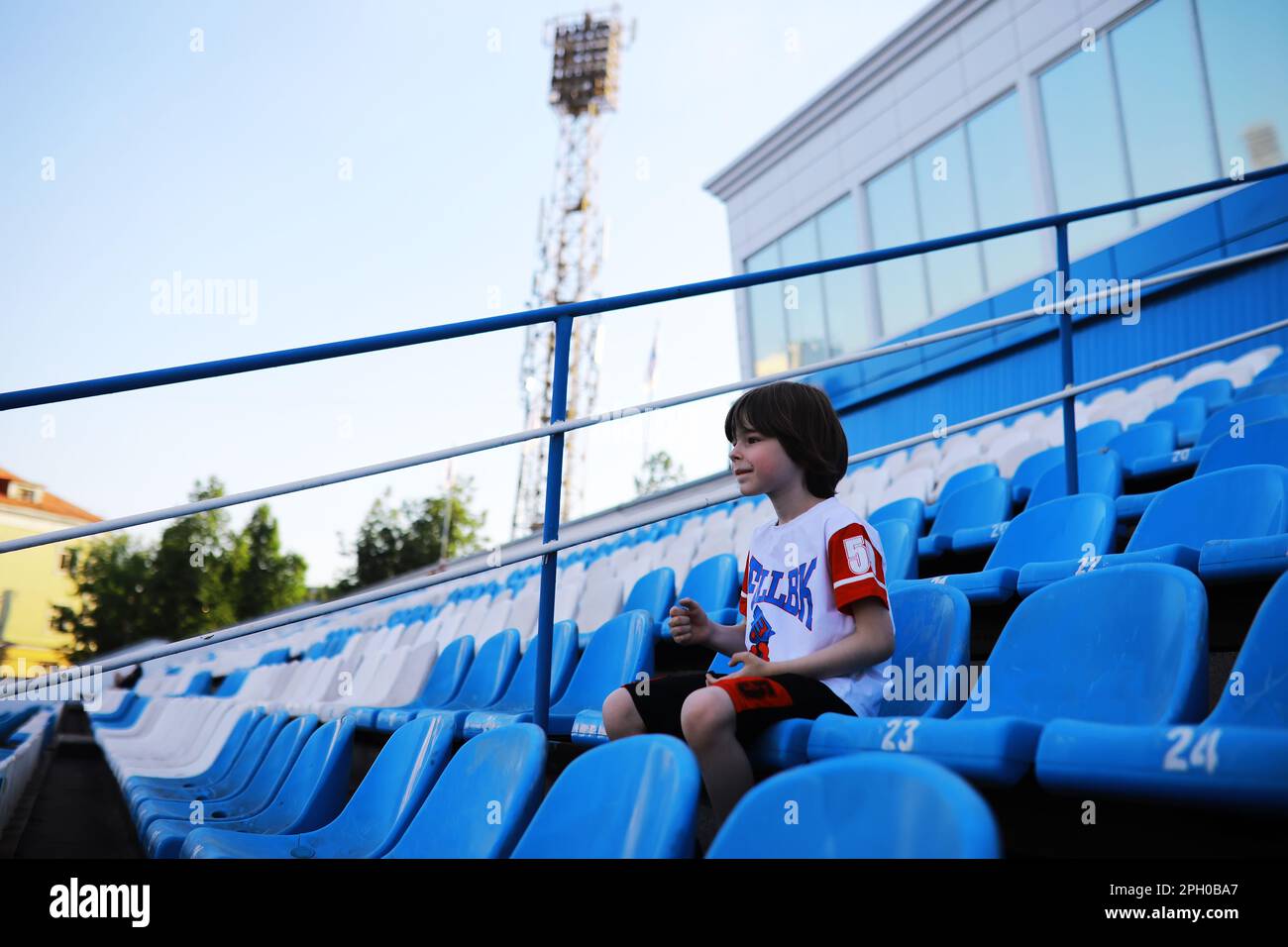Plastic chairs in the stands of a sports stadium. Cheer on the stands ...