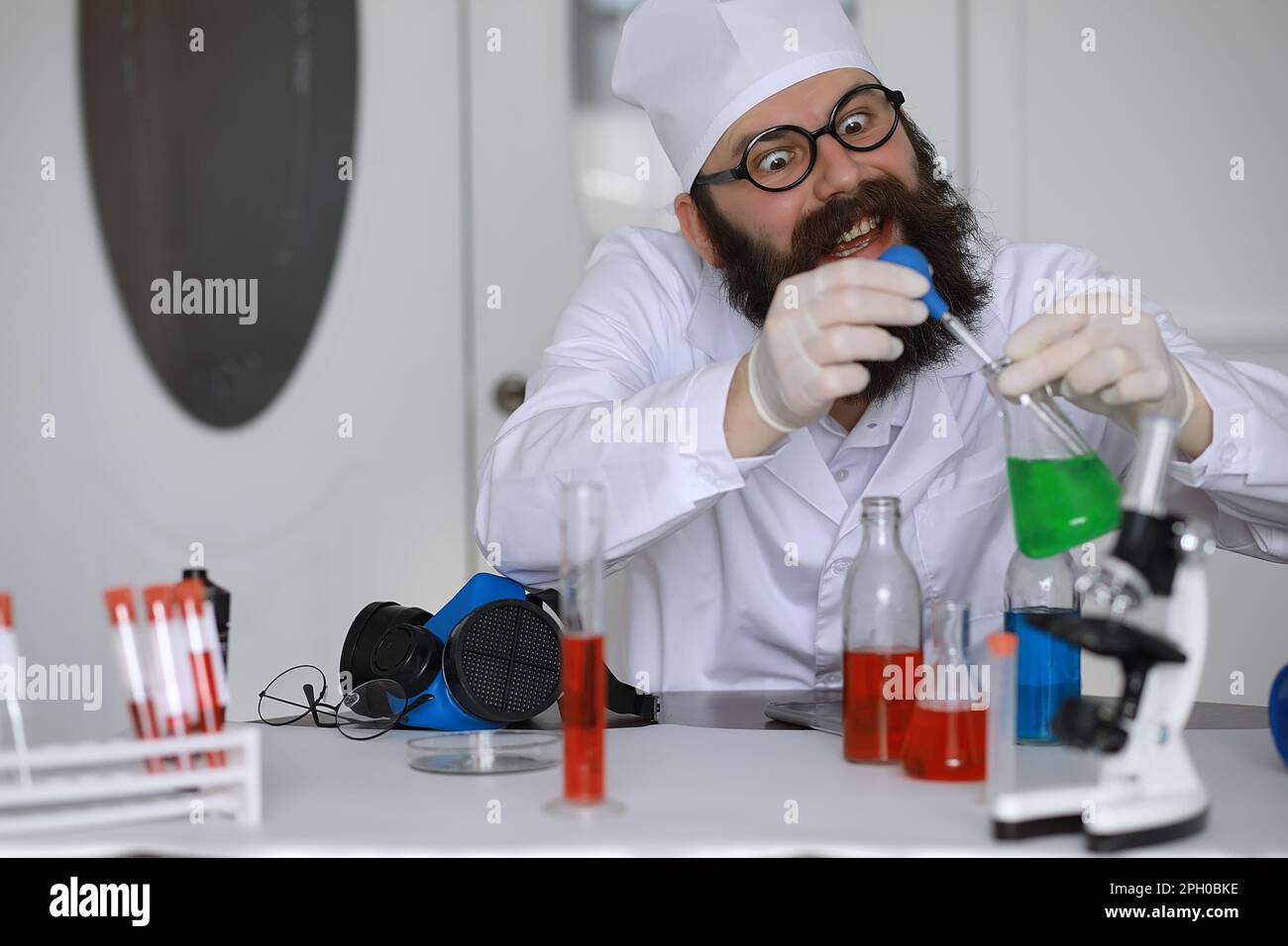 Chemist crazy. A mad scientist conducts experiments in scientific ...