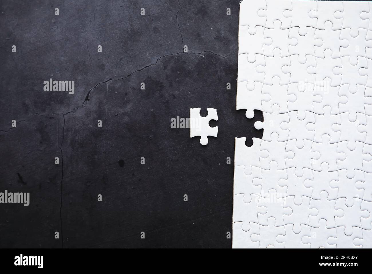 Intellectual puzzles. The puzzle empty. The hand puts together puzzle ...