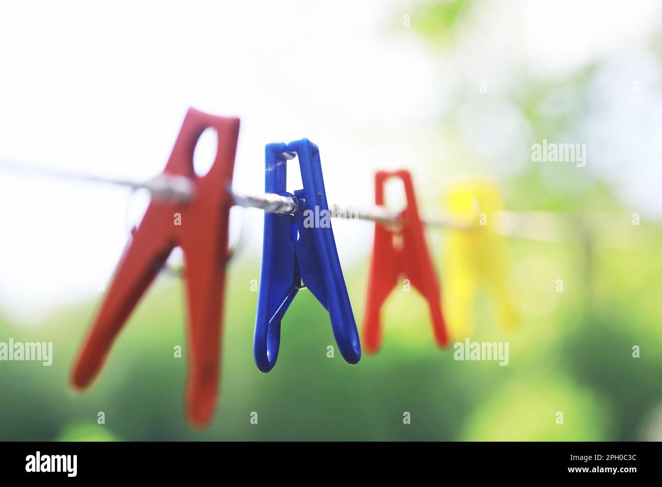 Clothespins on a clothesline in summer. Dry clothes outside. Clothes on ...
