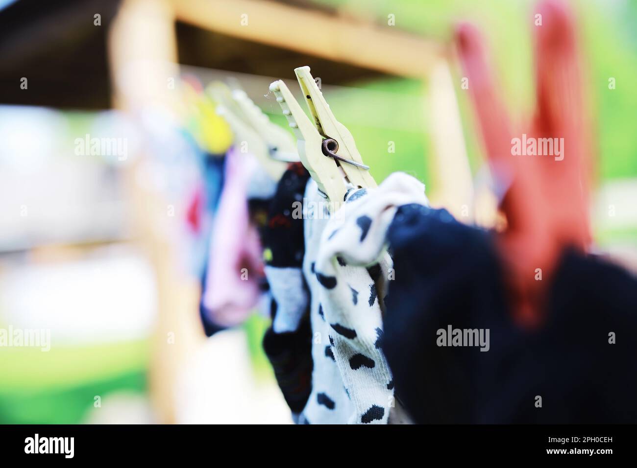 Clothespins on a clothesline in summer. Dry clothes outside. Clothes on ...