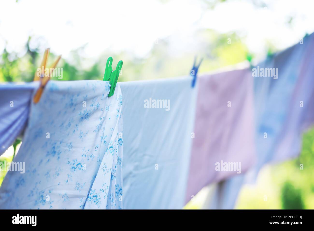 Clothespins on a clothesline in summer. Dry clothes outside. Clothes on ...