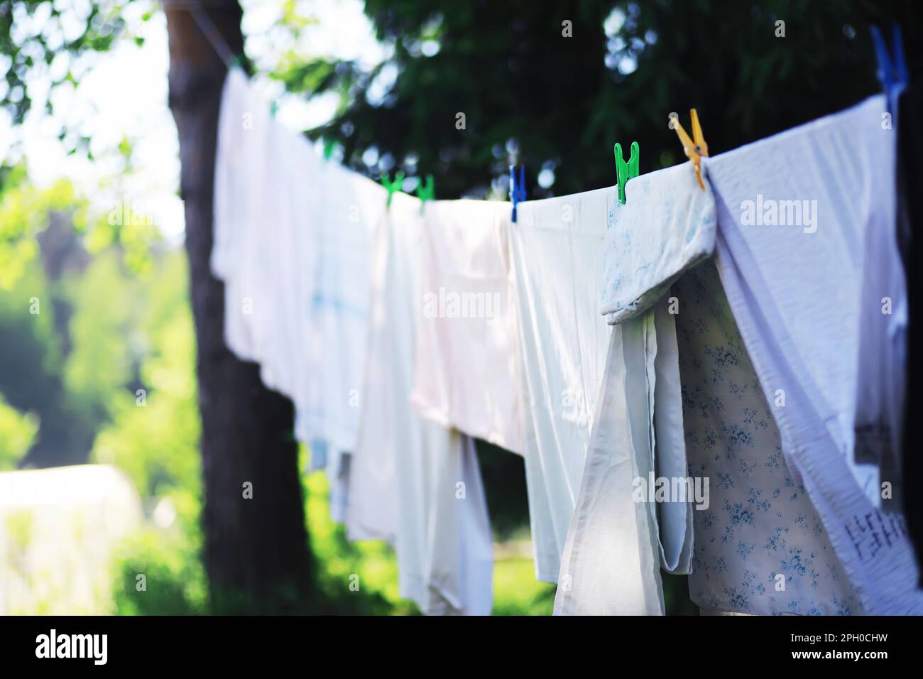 Clothespins on a clothesline in summer. Dry clothes outside. Clothes on ...