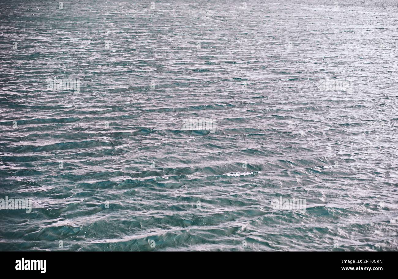 Water surface. The texture of the water. Waves on the lake windy ...