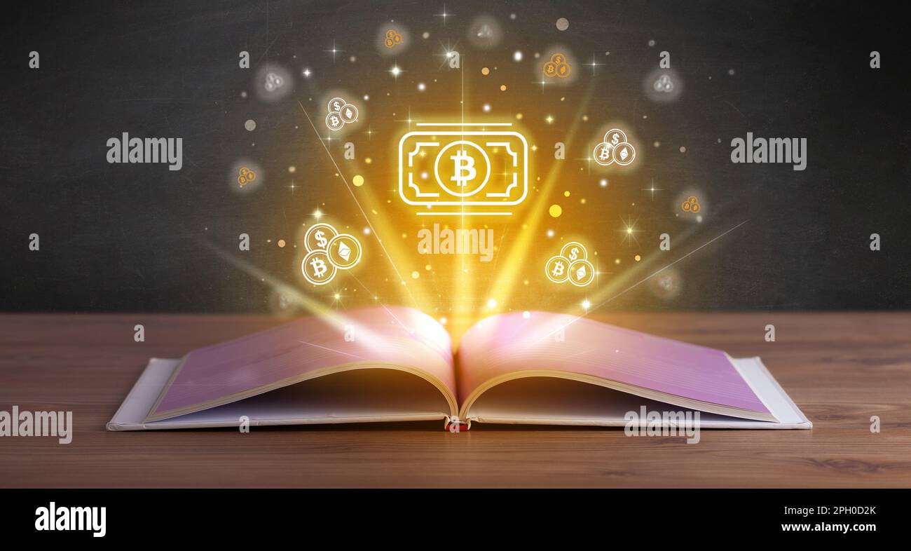 Open book with currency icons above Stock Photo - Alamy
