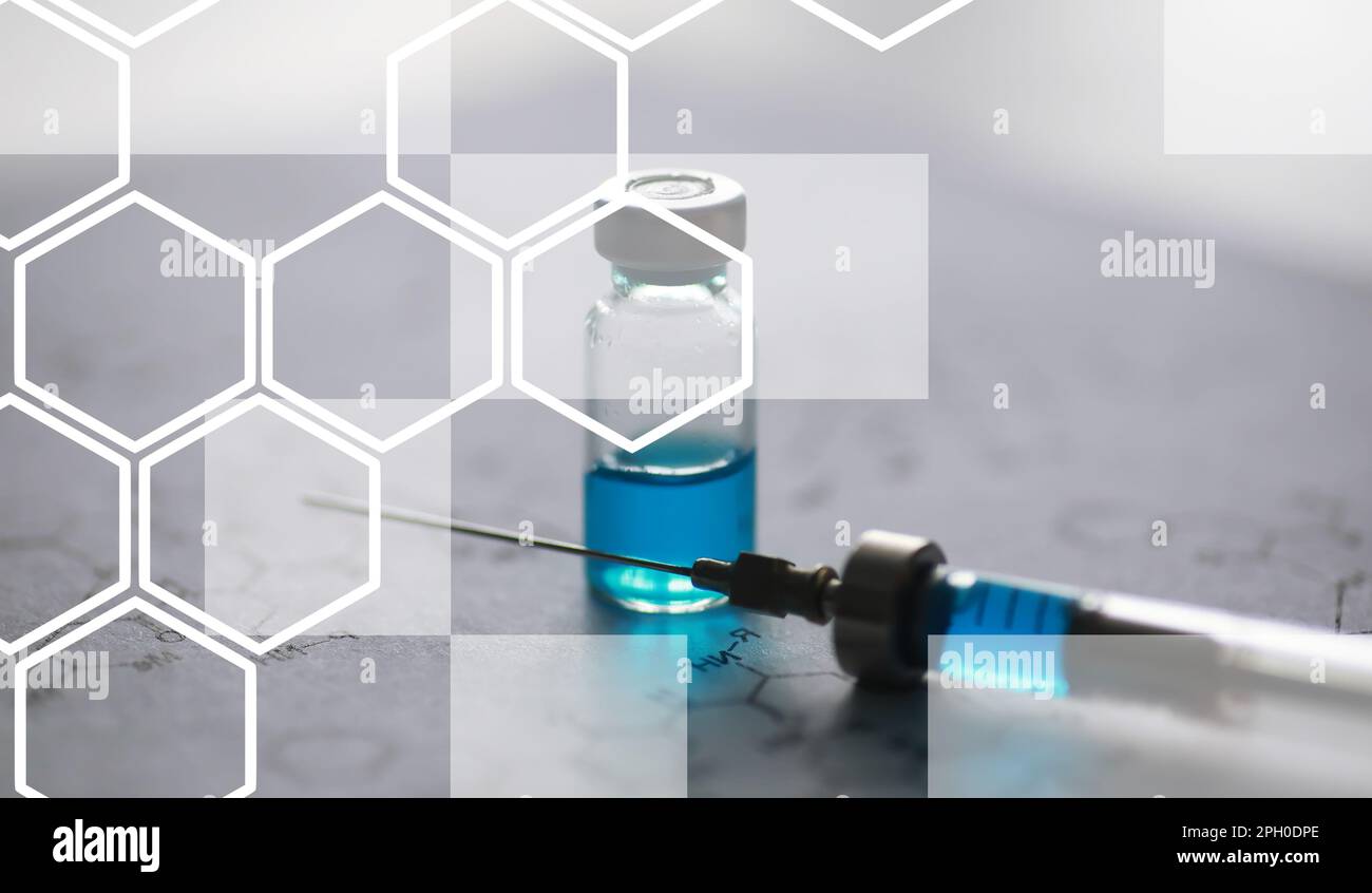 small jars with injection and syringe for injection on blue background ...