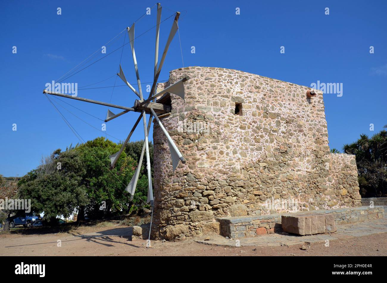 Greece, old windmill built of stone at the monastery of Toplou, located ...