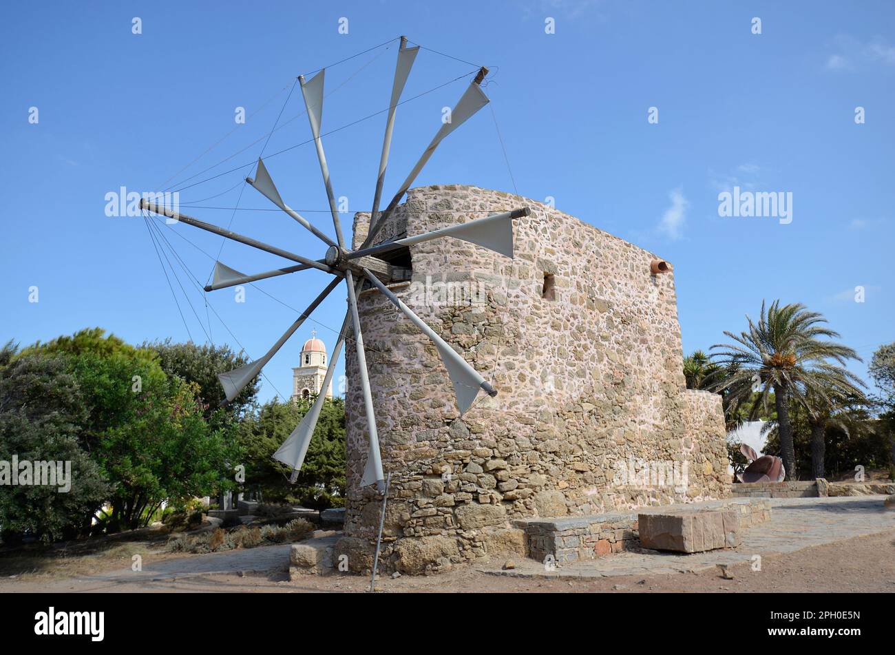 Greece, old windmill built of stone at the monastery of Toplou, located ...
