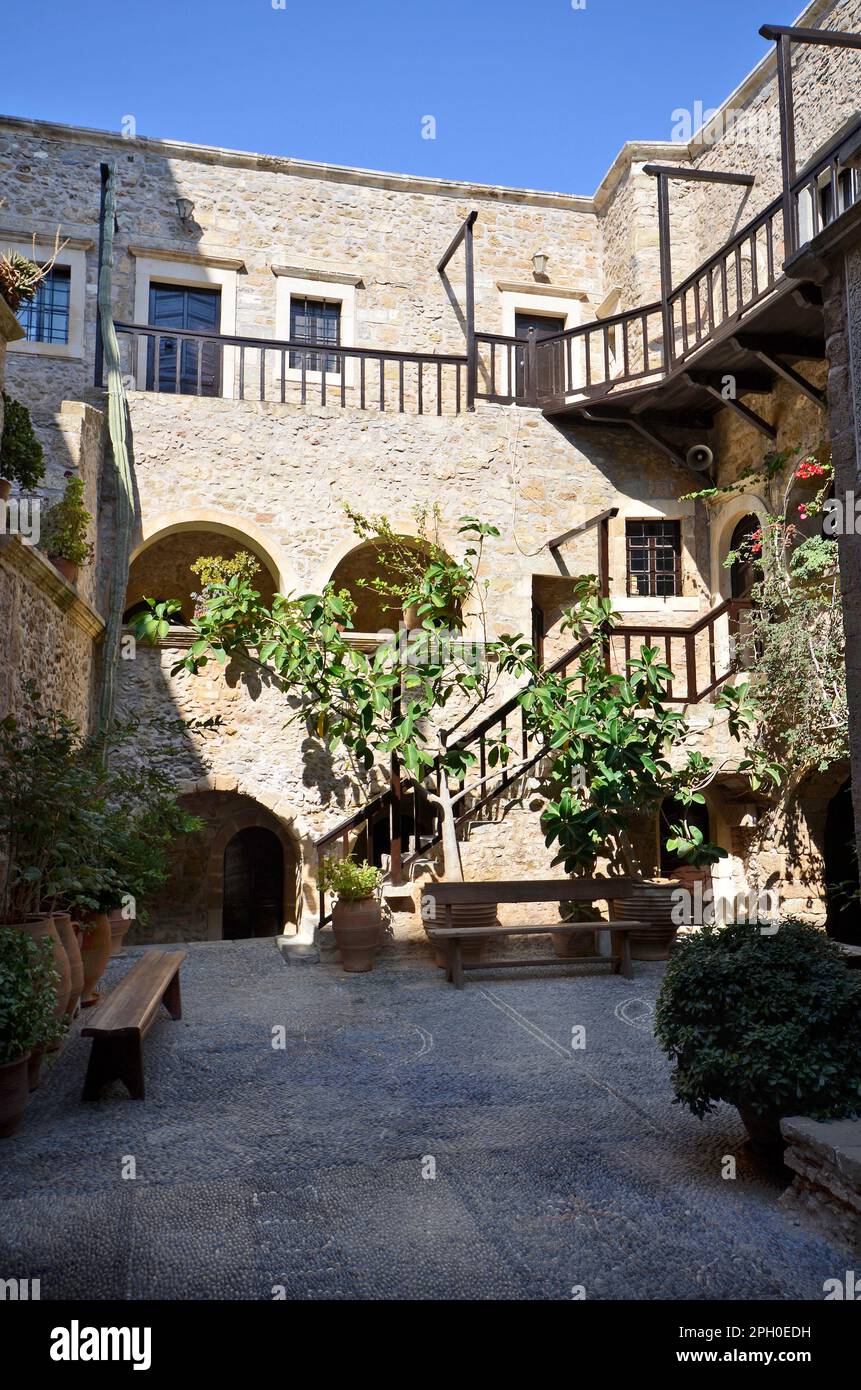 Greece, courtyard with stone mosaic in the monastery of Toplou, located ...