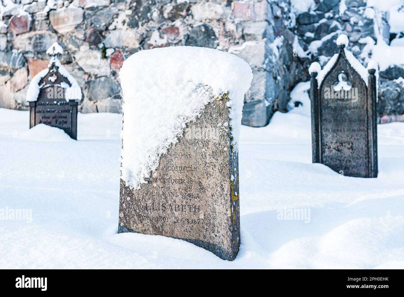 A snow-covered graveyard in Sweden, with no people and a cold winter ...