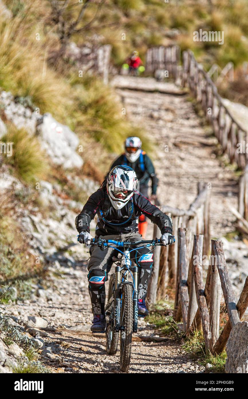 Two bikers riding down a trail Stock Photo - Alamy
