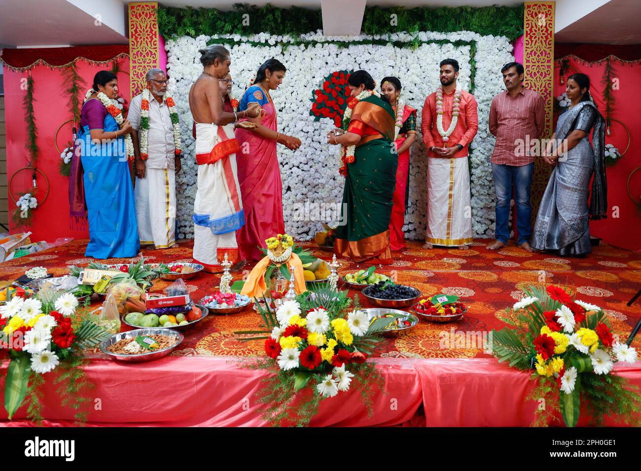 Bride and groom are greeted by parents,relatives and guests at the ... Bride and groom are greeted by parents,relatives and guests at the ...