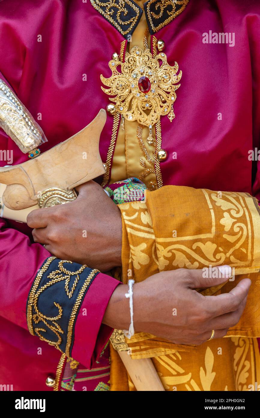 Traditional Balinese male wedding dress, gold jewelry and a ceremonial ...