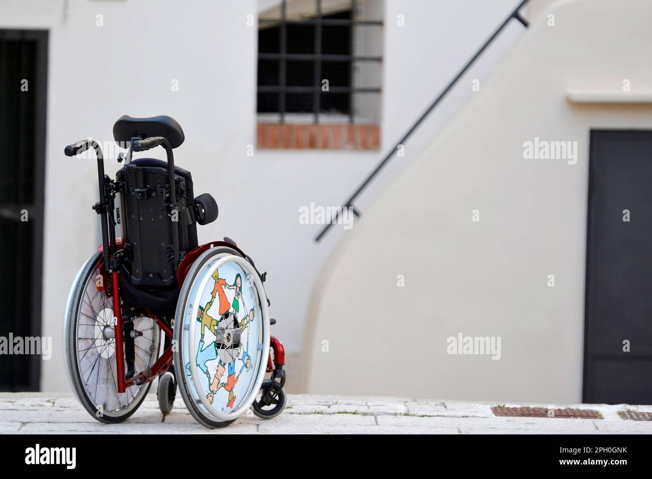 Wheelchair in front of an architectural barrier Stock Photo - Alamy