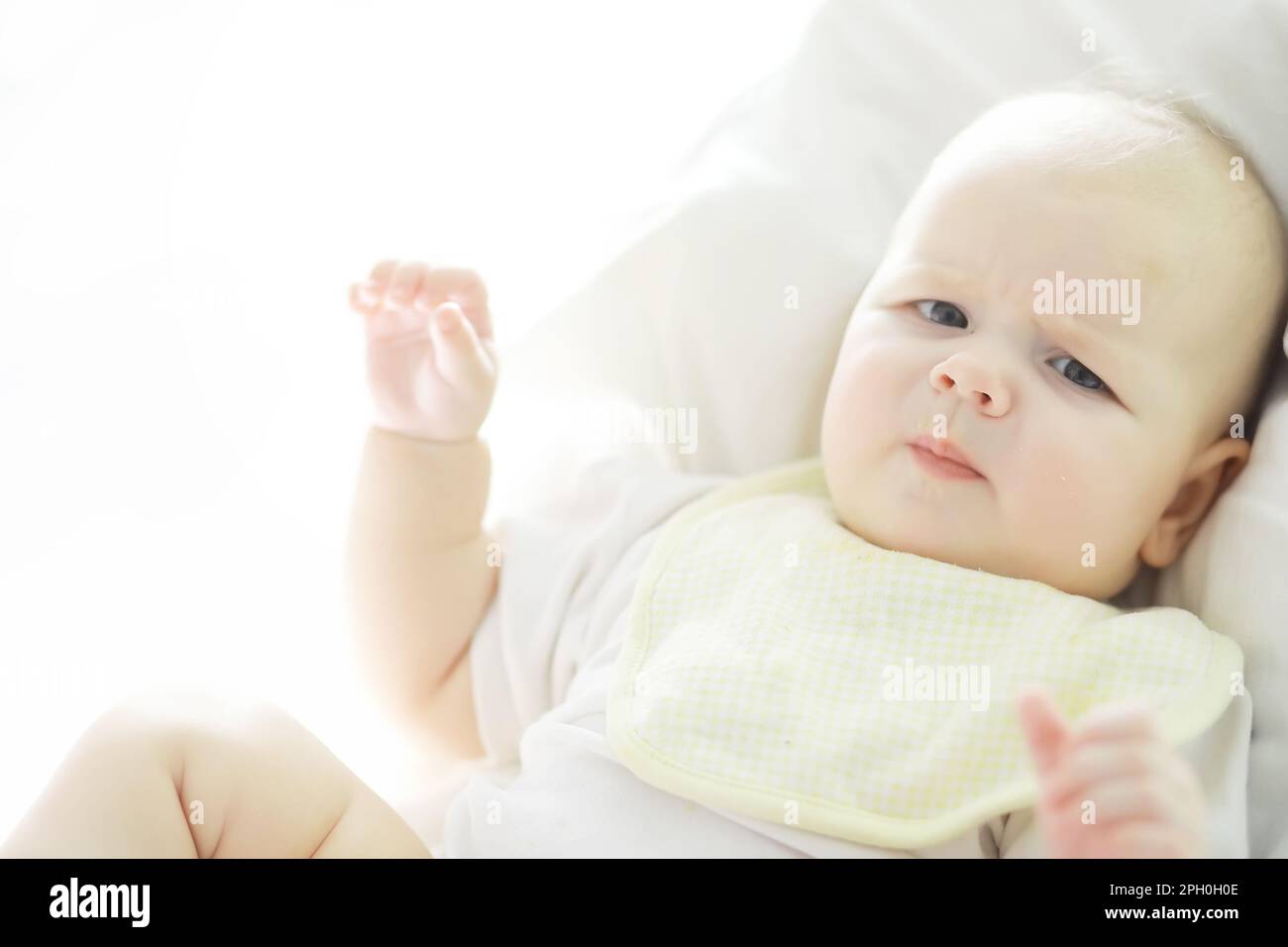 Maternity concept. A young mother feeds her little baby. First lure and ...