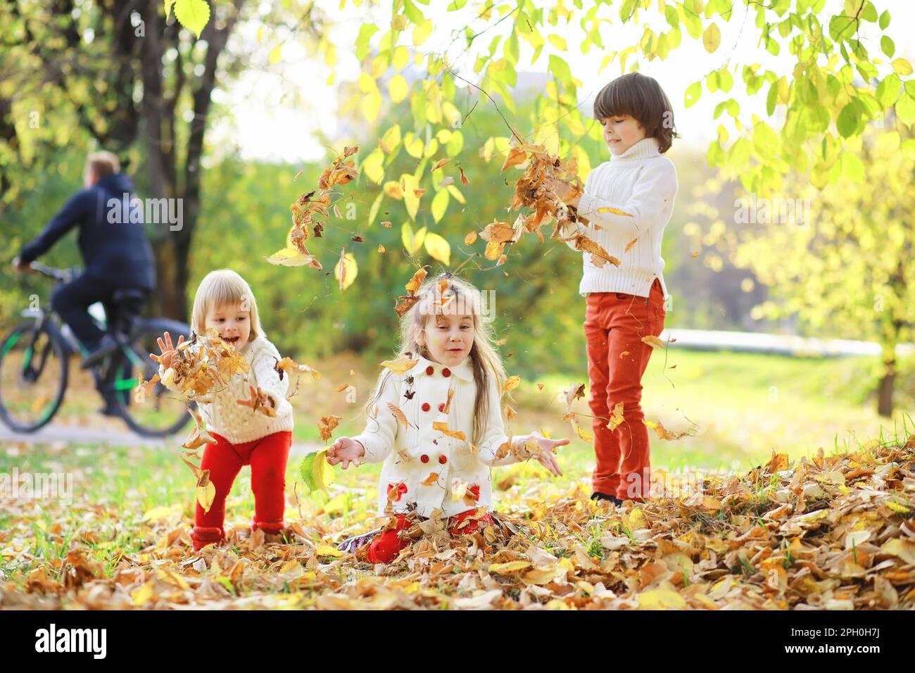 Children for a walk in autumn park. Leaf fall in the park. Family. Fall ...