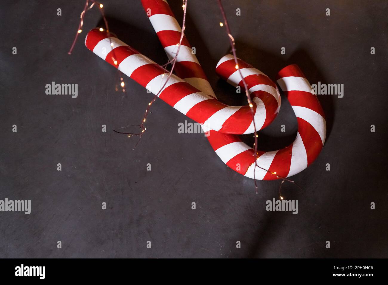 Striped red candy canes ,decoration for Christmas party on dark ...