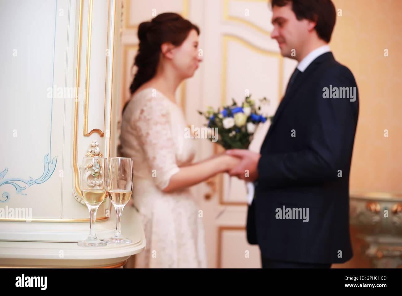 Portrait of emotional lovers of brides indoor.Bride and groom kisses ...