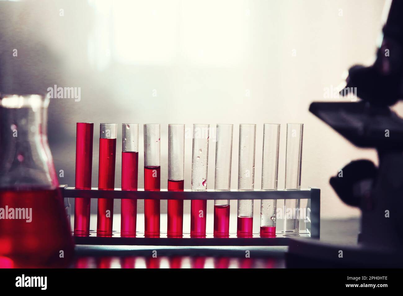 Test tube with blue liquid on laboratory table. Examination of liquid ...