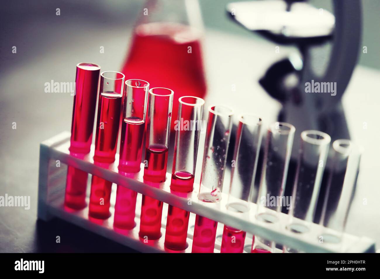 Test tube with blue liquid on laboratory table. Examination of liquid ...