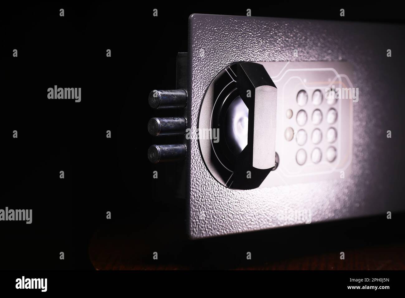 Steel safe with money. Hand putting password in the safety money box in ...