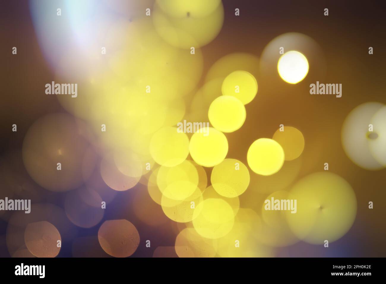 Abstract bokeh background. Golden bokeh circles on a dark blue ...