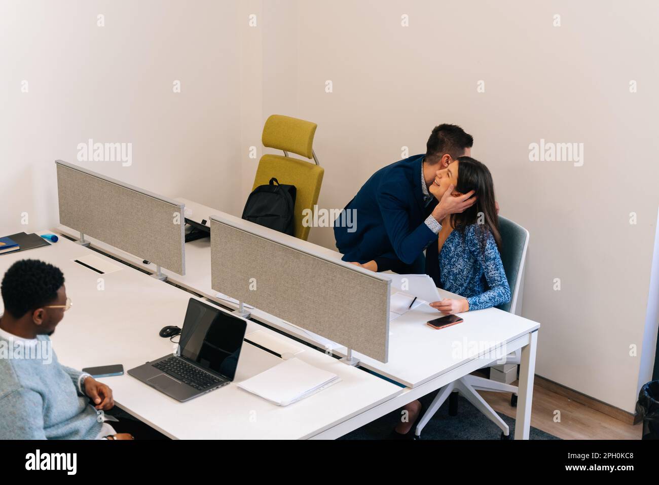 A greeting between two colleagues at work Stock Photo - Alamy