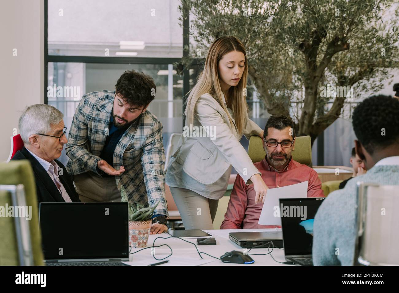 Two partners discussing the papers together about the upcoming project ...