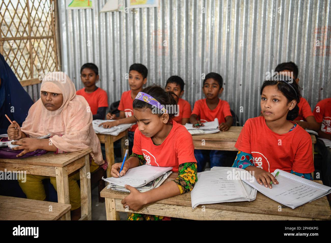 Underprivileged children attend classes at the Obhizatrik School in Dhaka. According to reports ...