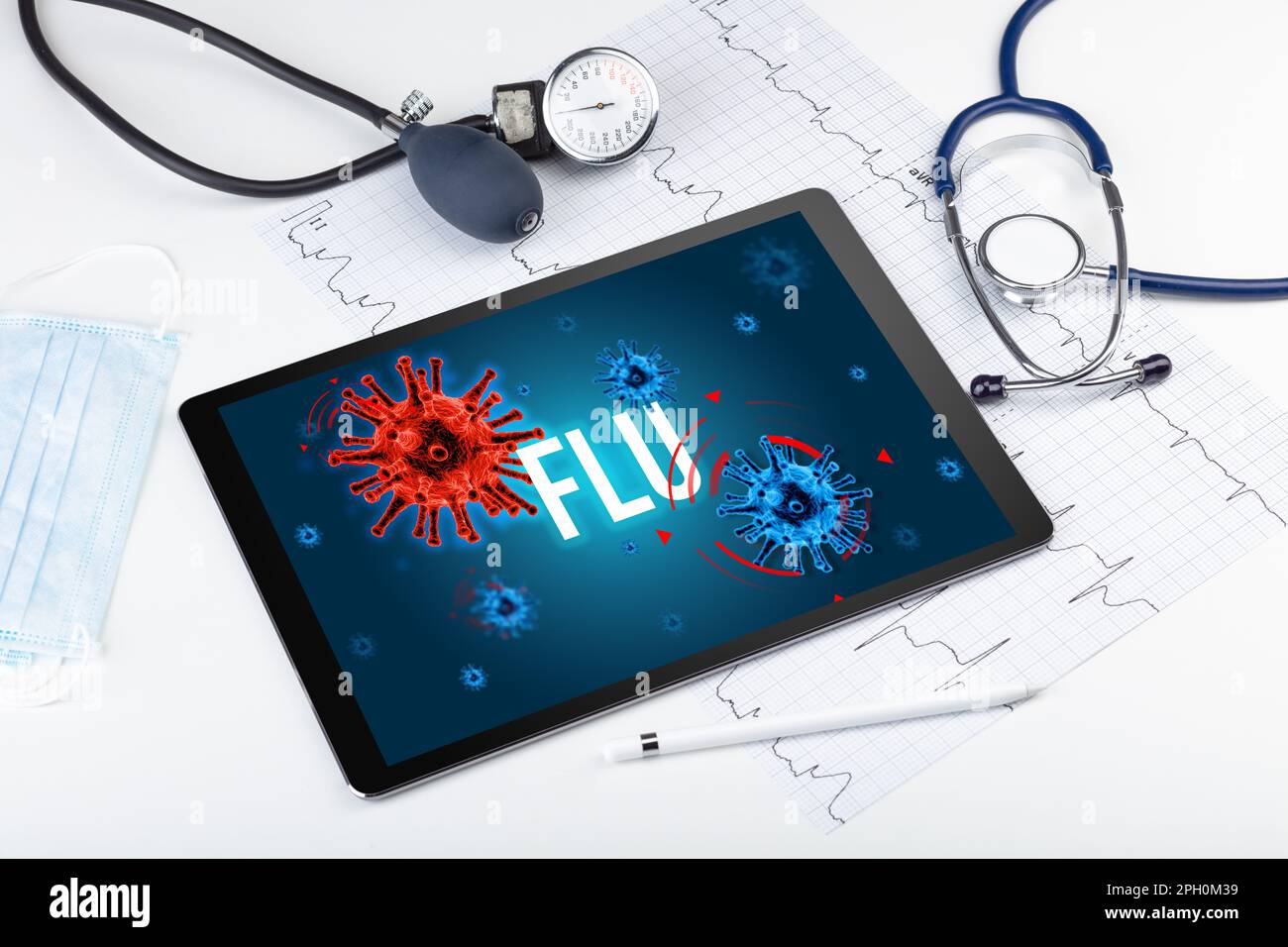 Tablet pc and doctor tools on white surface Stock Photo - Alamy