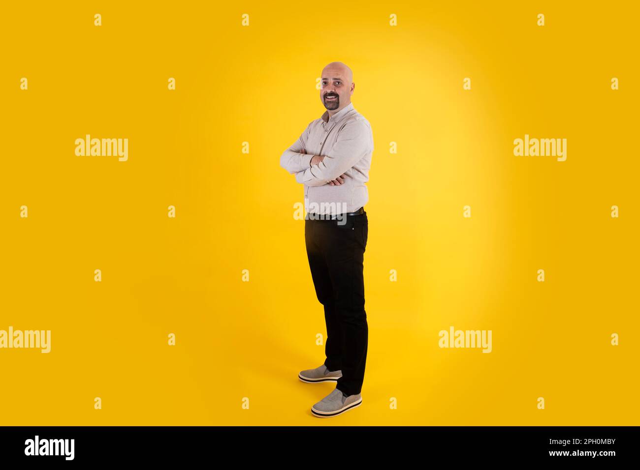 Full body portrait of man. Isolated yellow background, copy space ...
