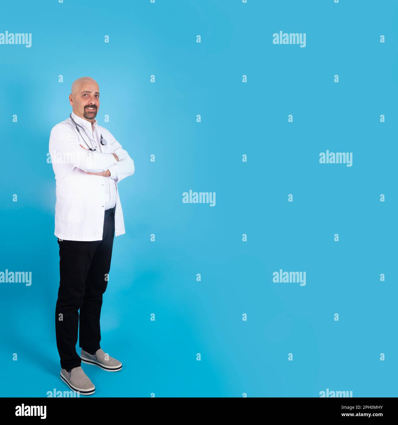 Portrait of trusted middle aged male doctor. Physician in white coat ...