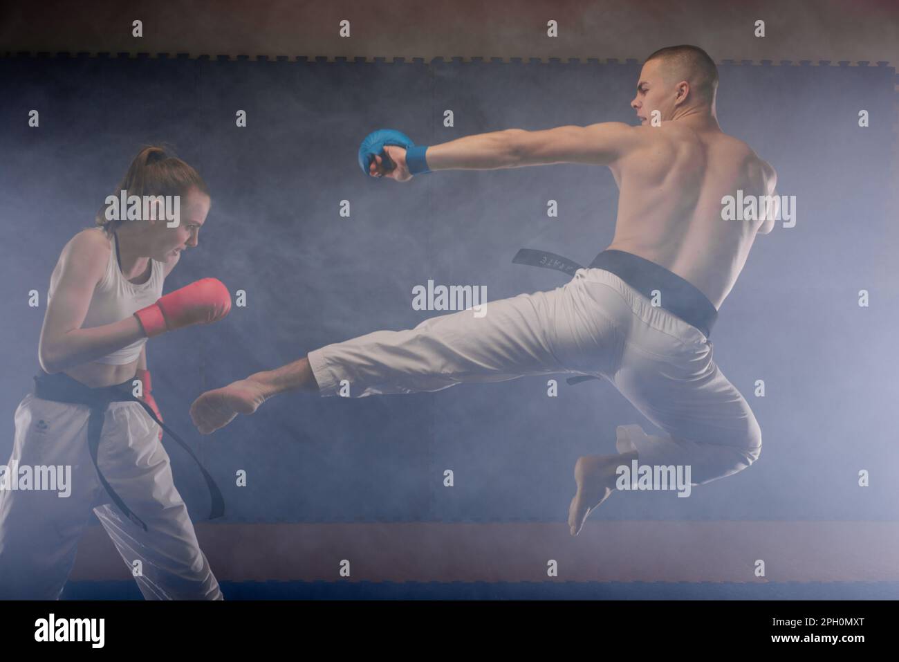 Two karate colleagues doing the Yoko Tobi Geri practice at the karate ...