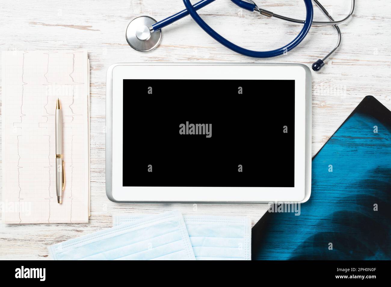 Mock up of doctors desktop with medical supplies Stock Photo - Alamy