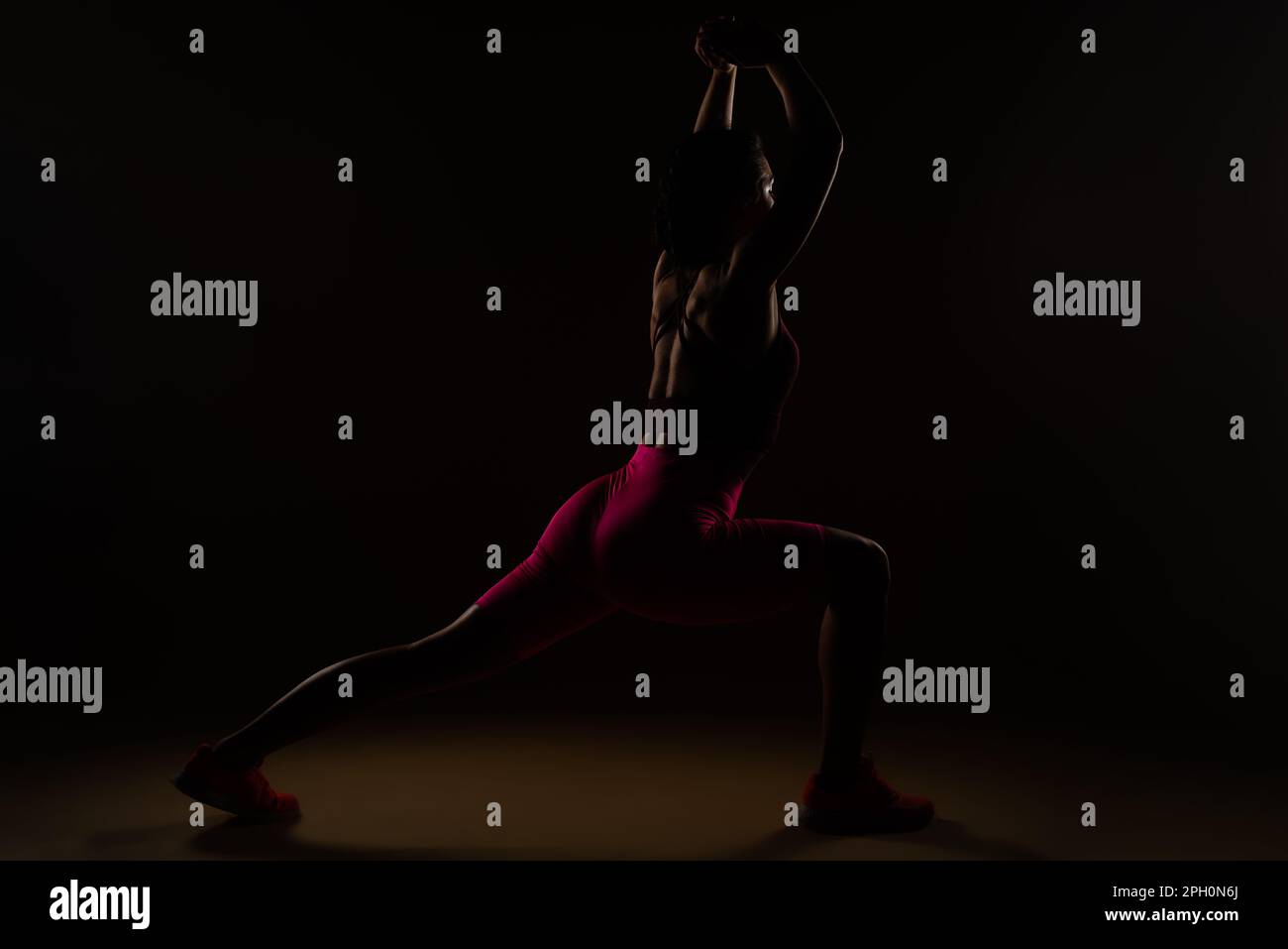 Strong woman exercising her legs. Step forward with the right leg. left ...