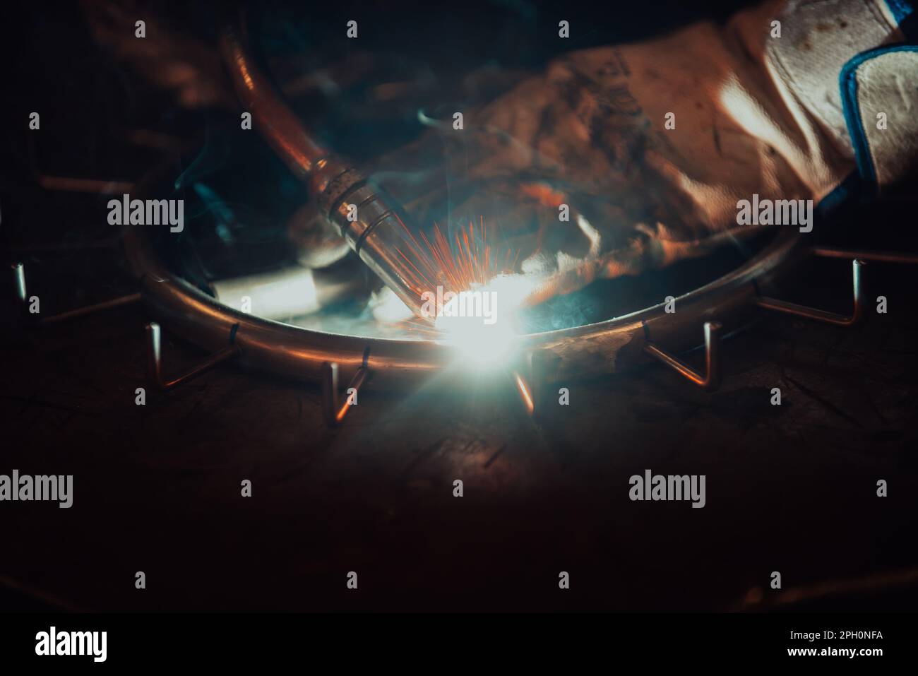 Close up of the steel welding process. Work in the heavy steel industry ...