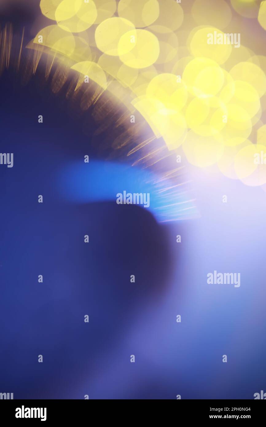 Abstract bokeh background. Golden bokeh circles on a dark blue ...