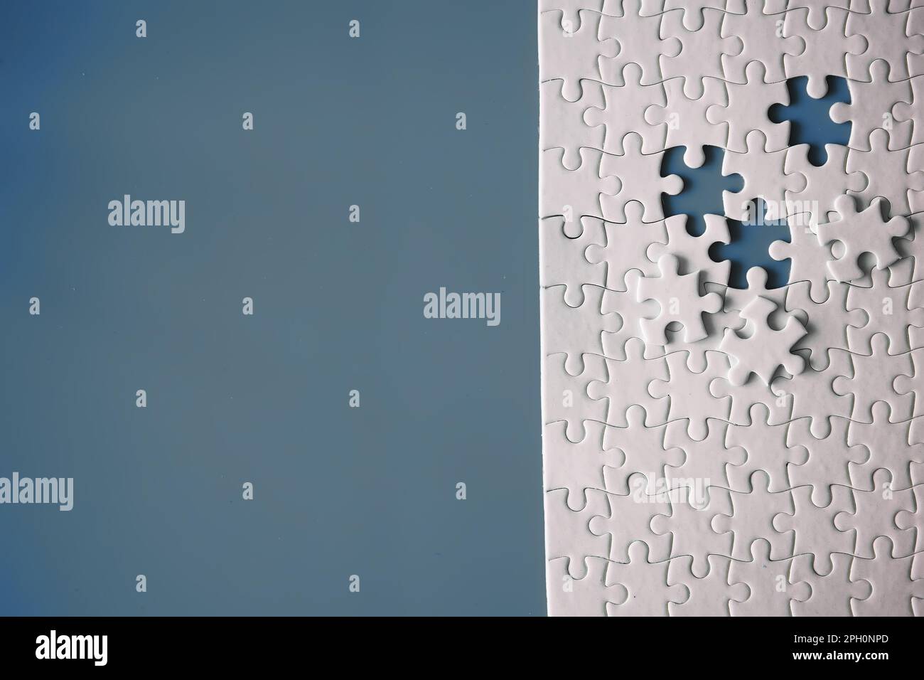 Clean puzzle elements on the background. Empty puzzle piece on table ...