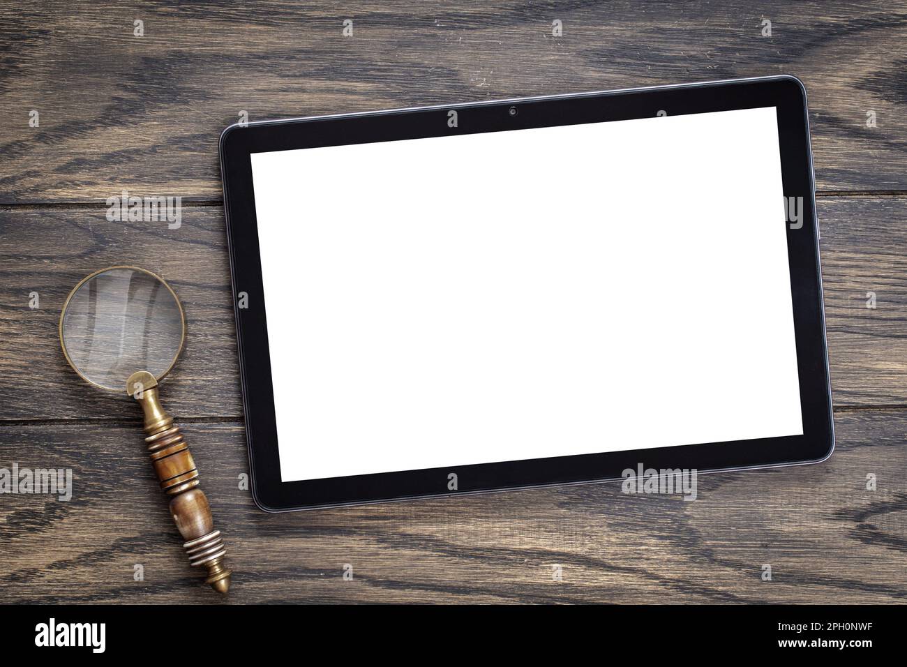 Mockup with tablet and magnifying glass on table. Computer science ...